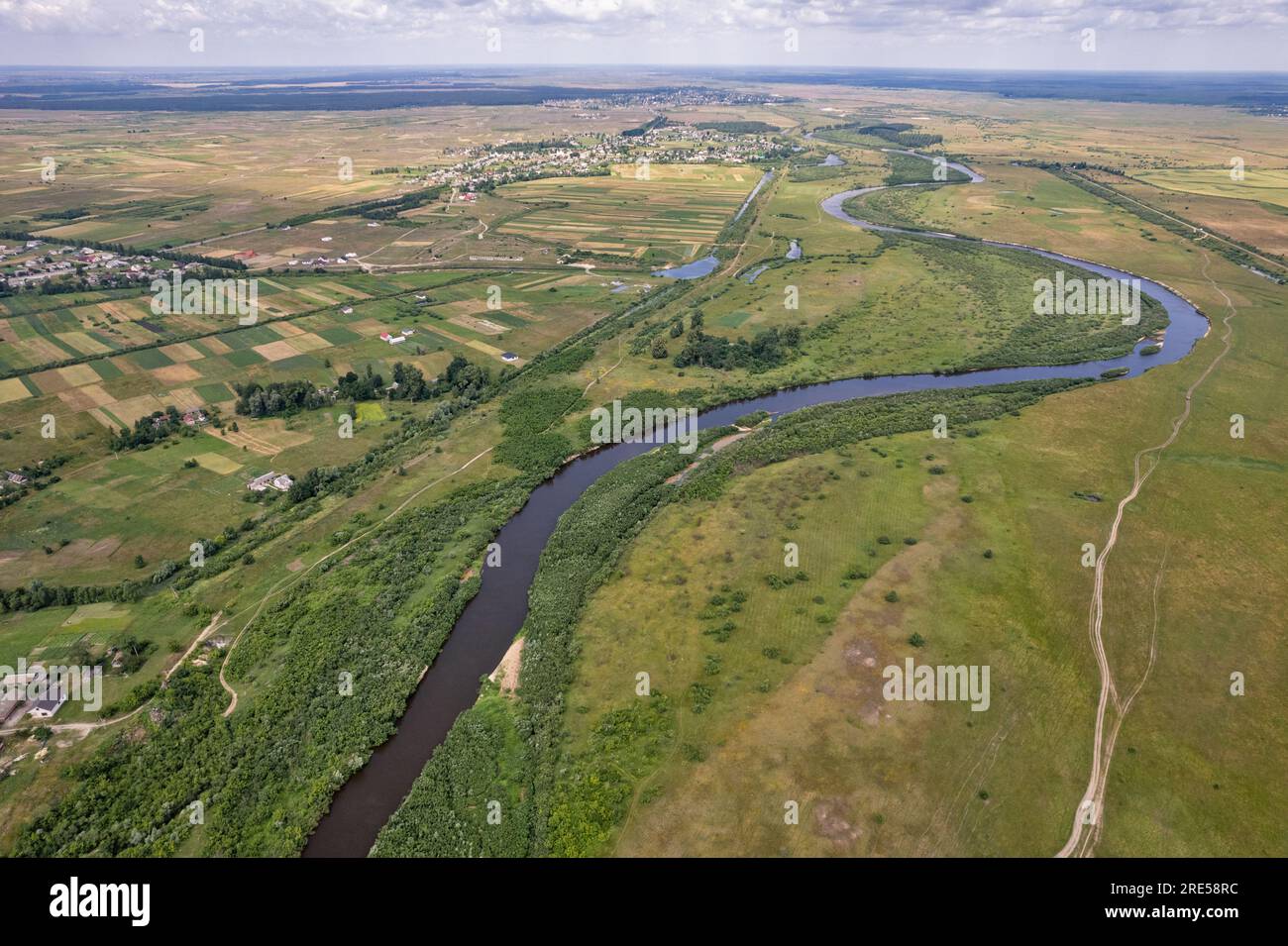 Aerial drone top view over Liukhcha village, Sluch river and lake in ...