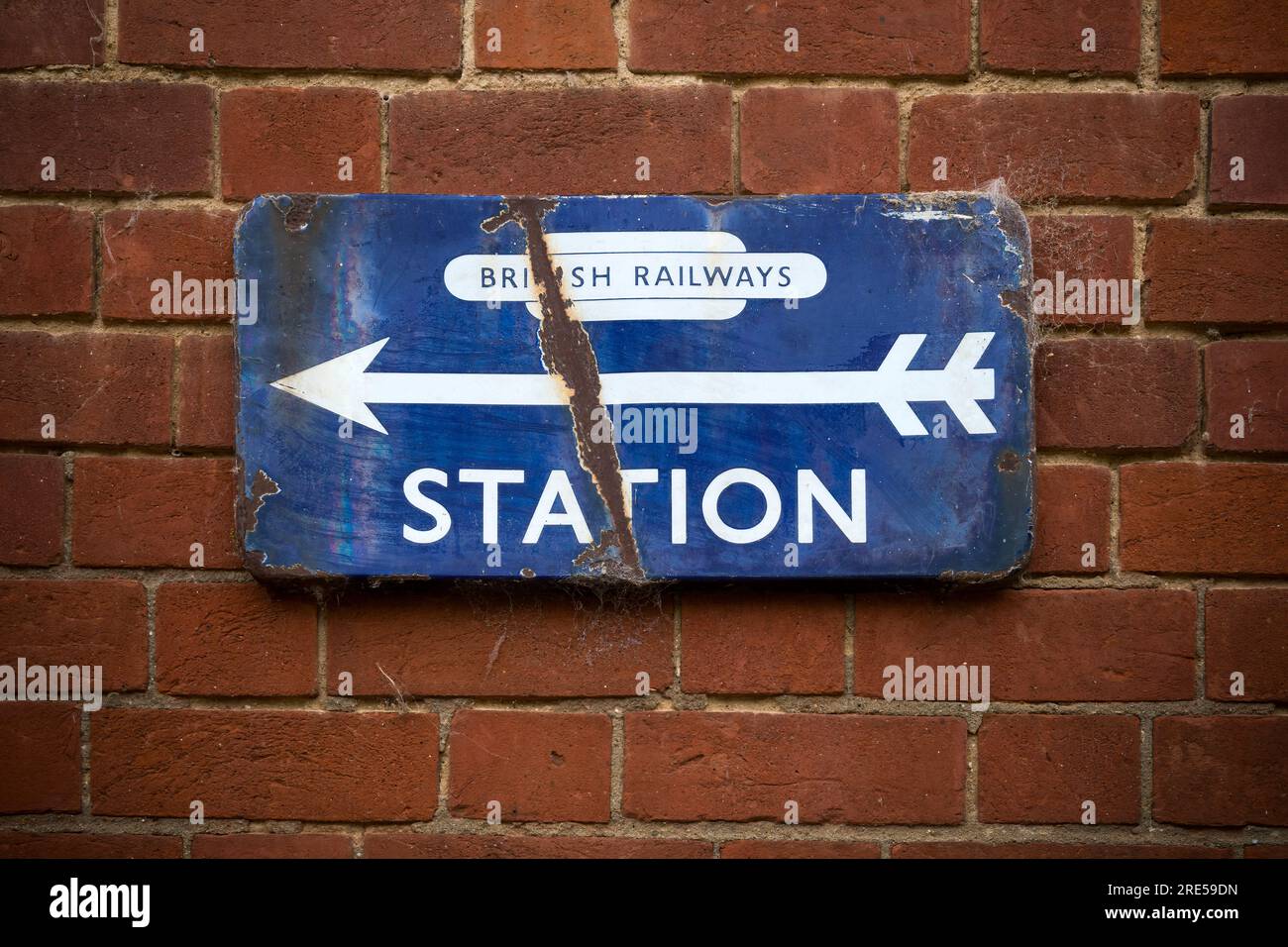Weathered old railway station sign on brick wall Stock Photo - Alamy