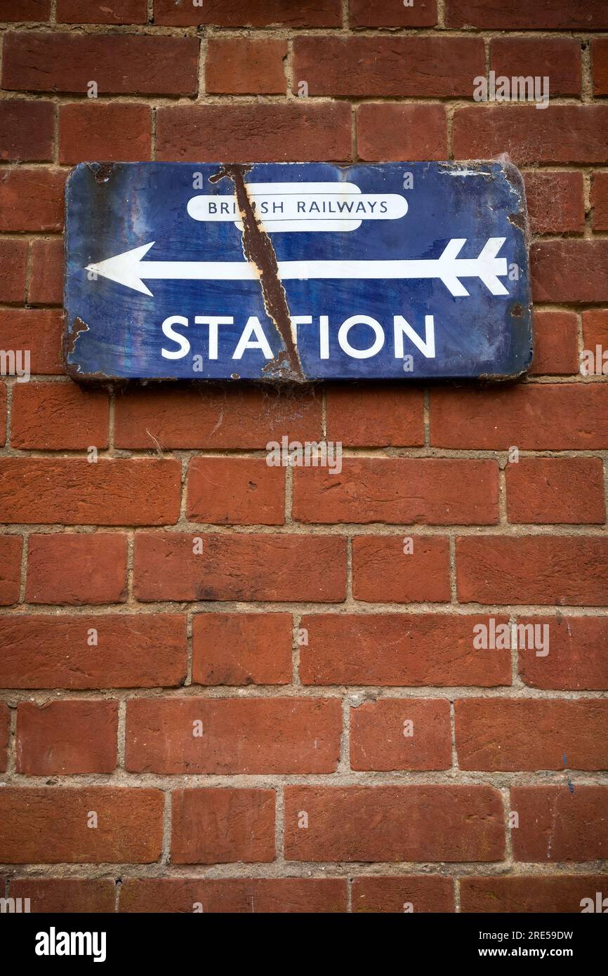 Vintage railway station sign on brick wall background Stock Photo - Alamy
