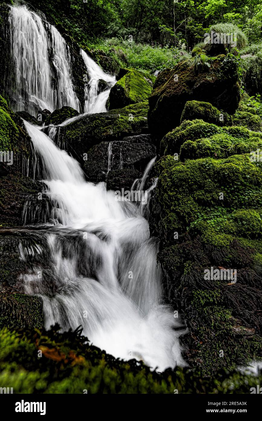 The hidden waterfalls in the wild alps Stock Photo - Alamy