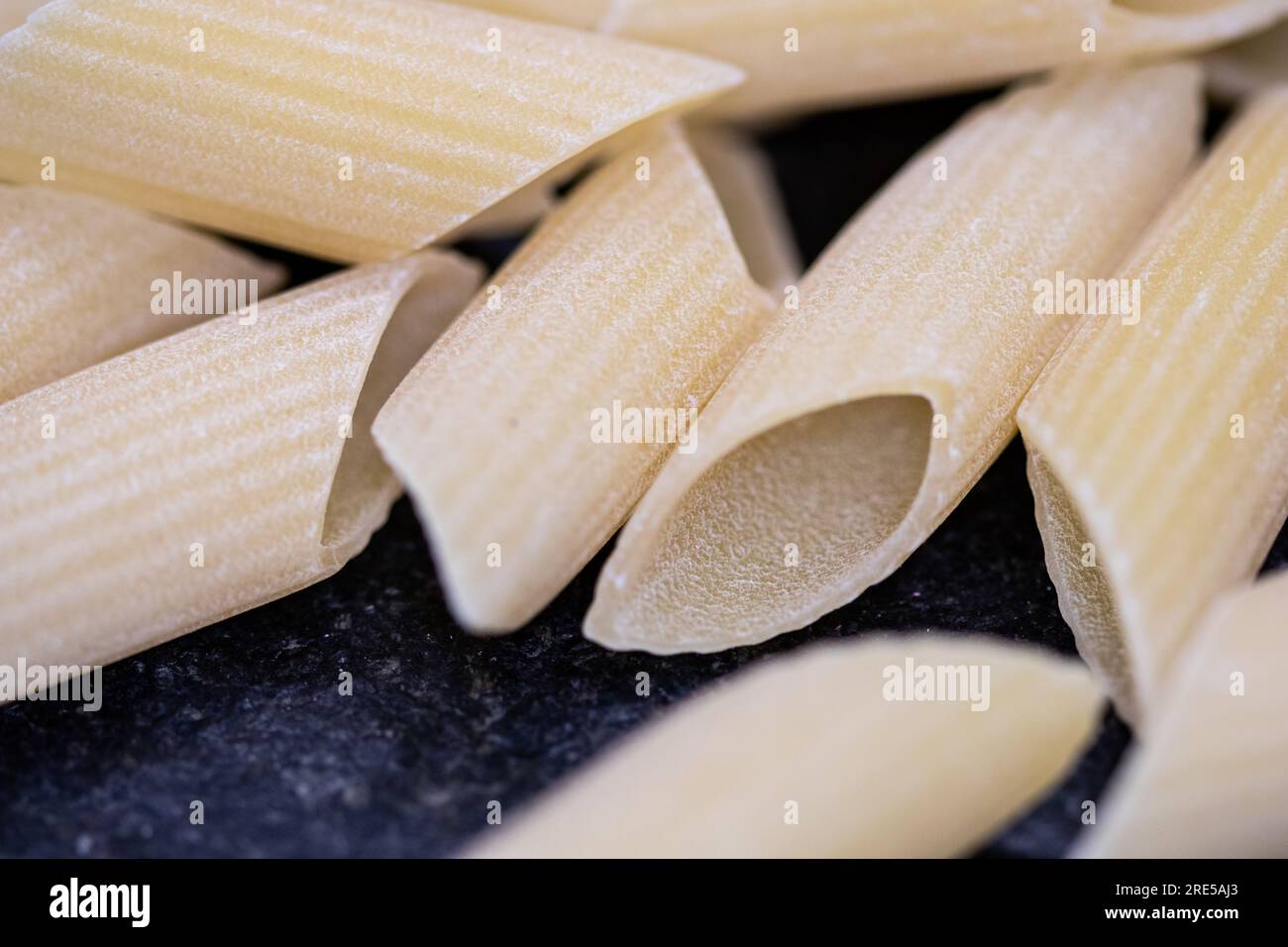 Penne pasta close up. Detail of famous kind of pasta Stock Photo - Alamy