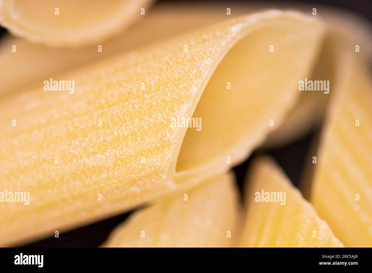 Penne pasta close up. Detail of famous kind of pasta Stock Photo - Alamy