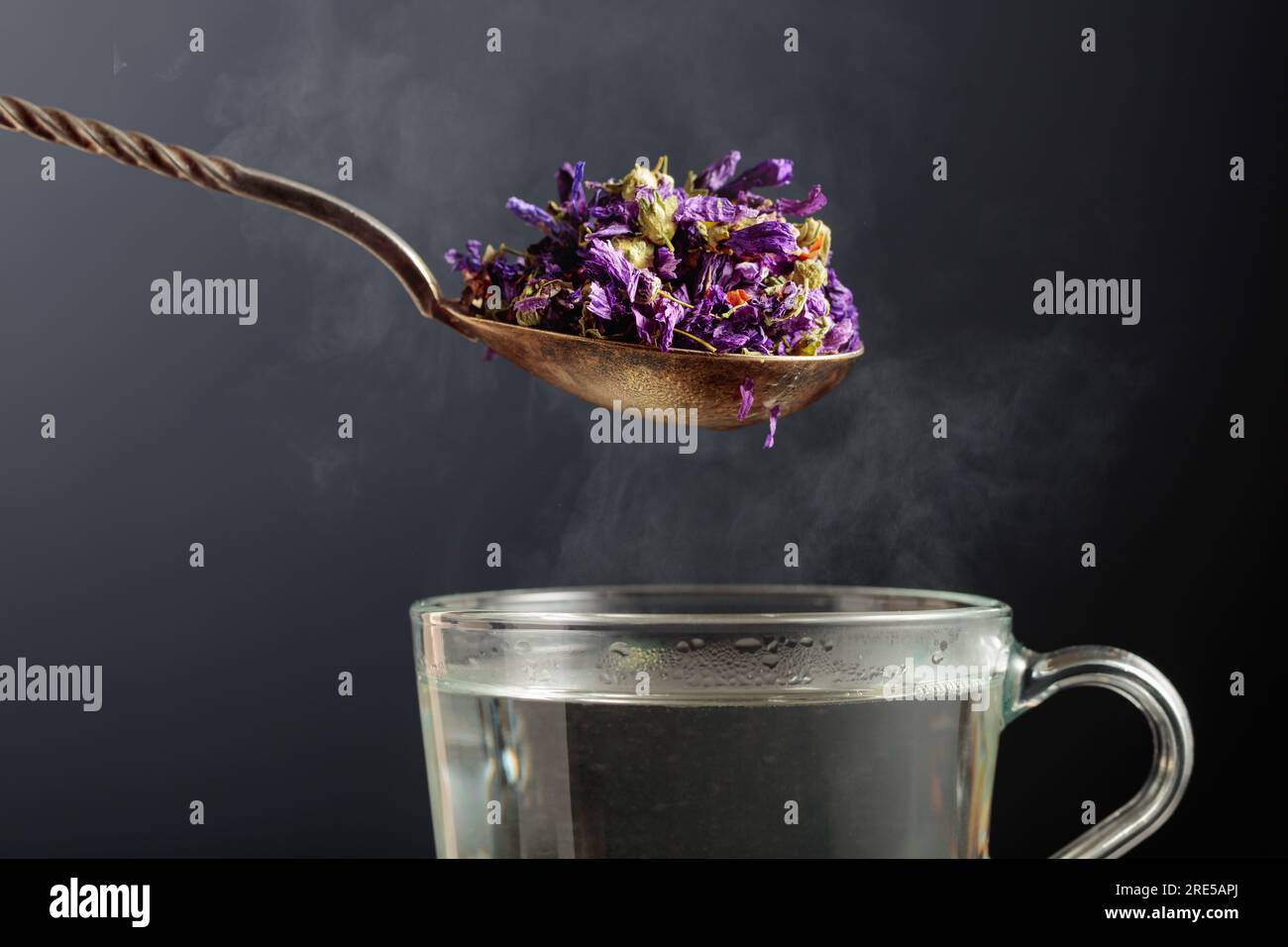 Dried mallow flowers for making herbal tea and mug with hot water Stock ...