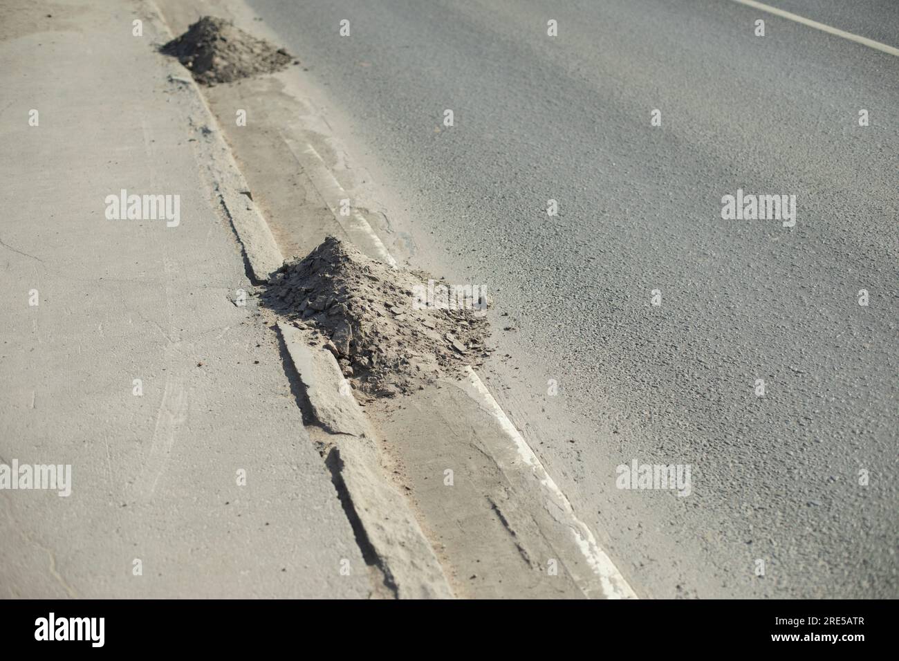 Dirt on road. Pile of garbage on side of road. Highway cleaning ...