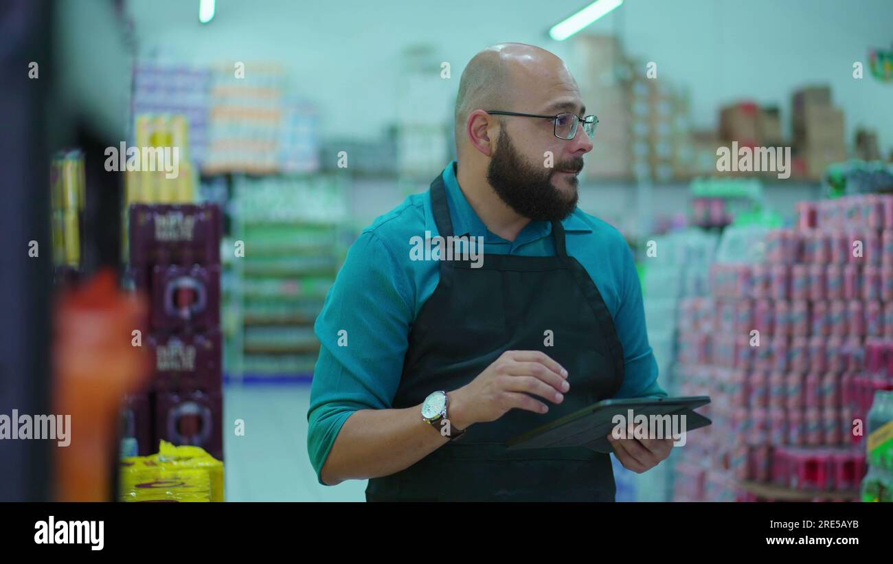 Joyful employee of Grocery store portrait smiling at camera standing in ...