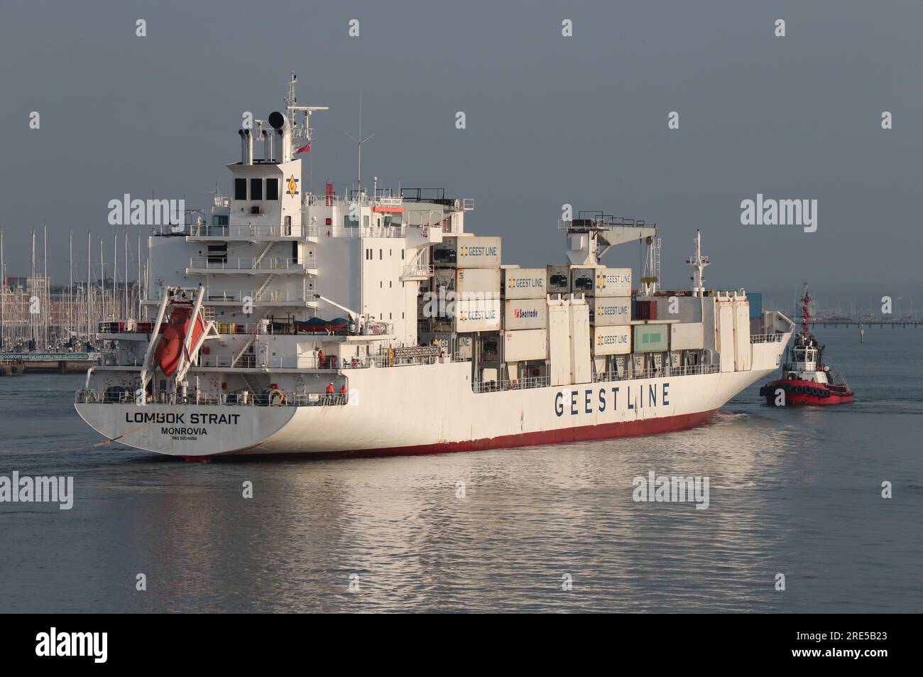 The refrigerated cargo ship MV LOMBOK STRAIT heads slowly towards a ... The refrigerated cargo ship MV LOMBOK STRAIT heads slowly towards a ...
