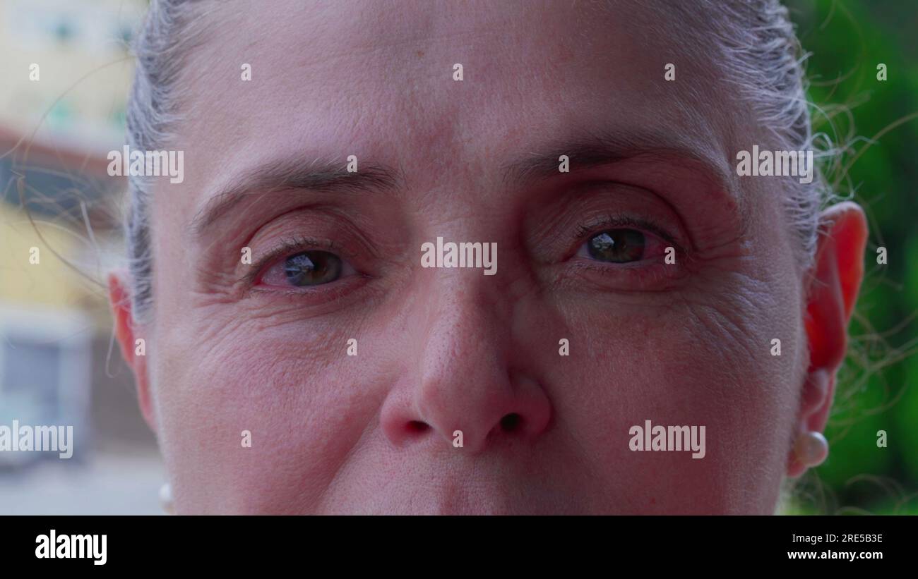 Macro Close Up Of A Mature Woman Eyes Staring At Camera With Neutral Stern Expression Middle