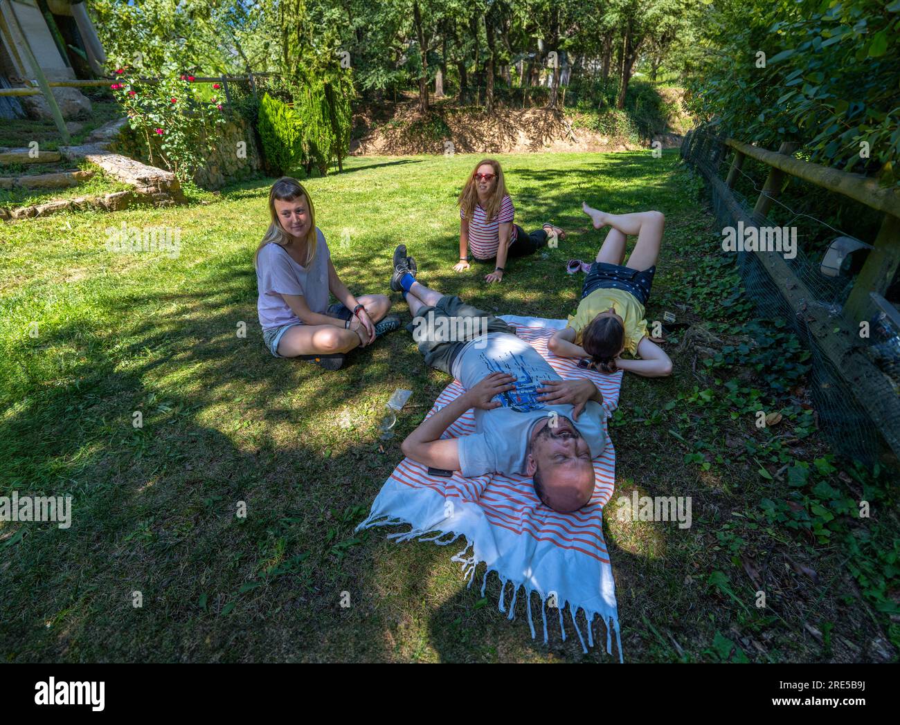 Group of male and female friends resting, napping, stretching and ...
