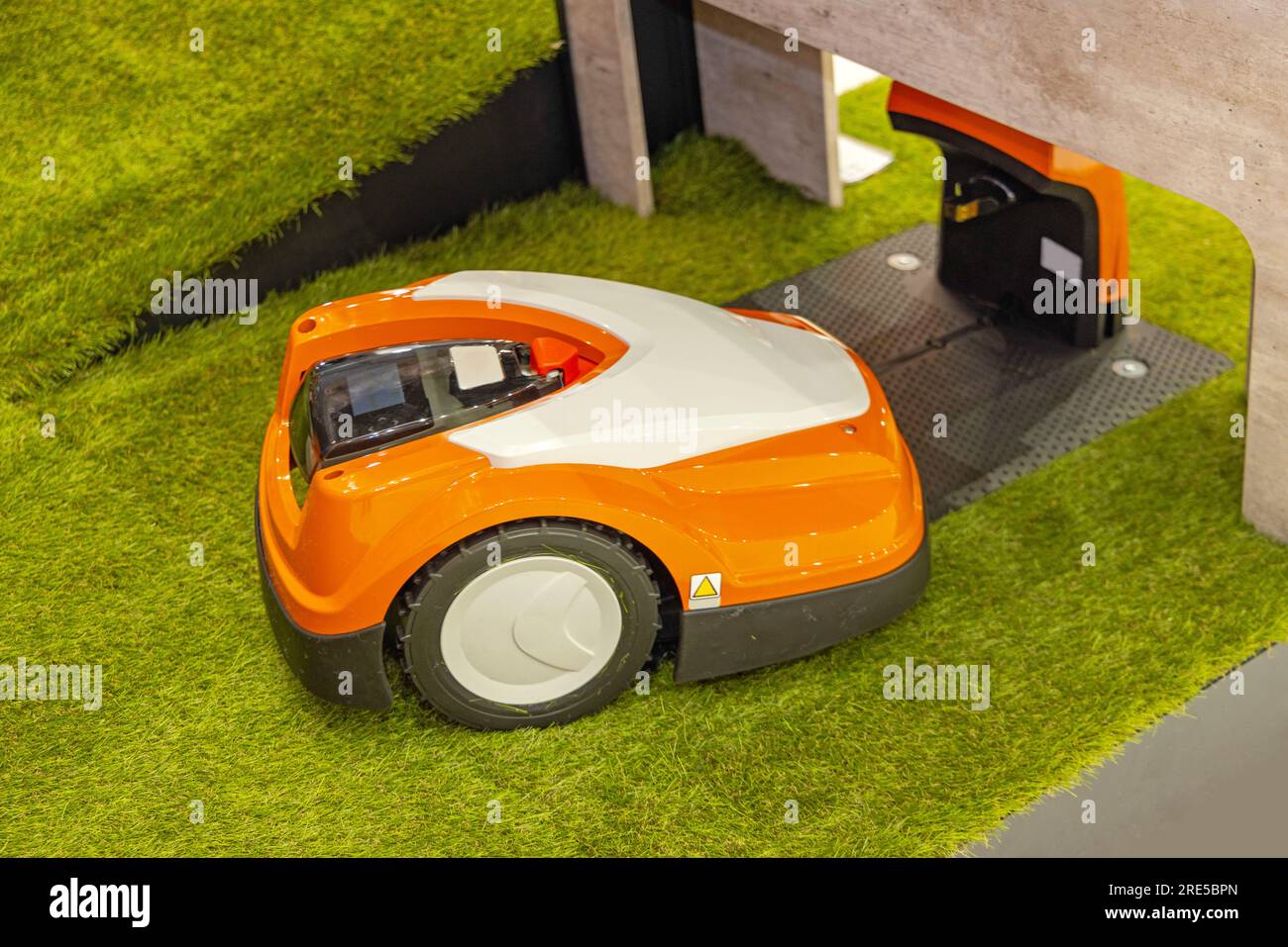 Automated Robot Lawn Mower Going to Docking Station Battery Charger Smart Garden Stock Photo - Alamy
