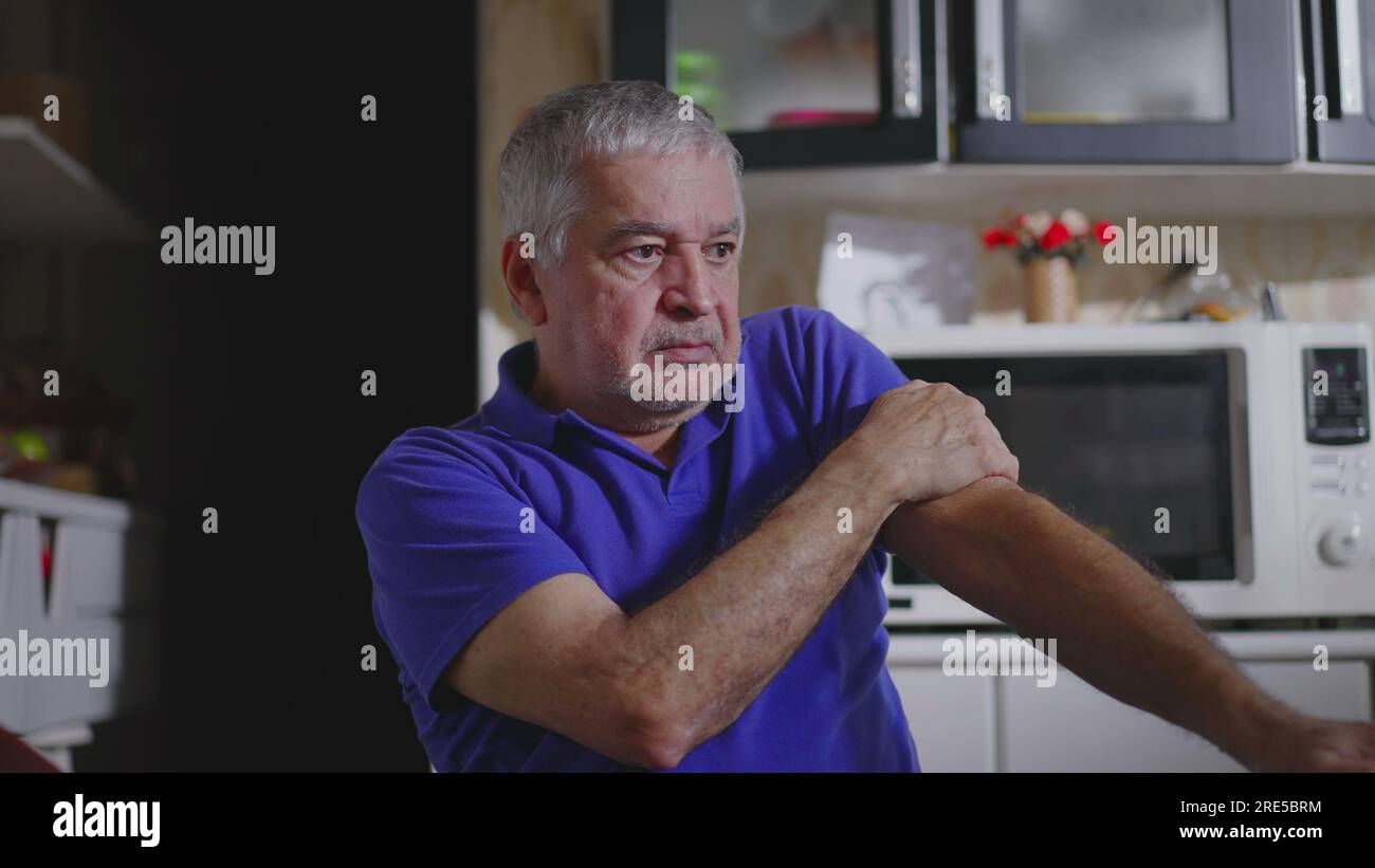 Melancholic Elderly Individual Sitting Alone at Kitchen Table, Senior ...