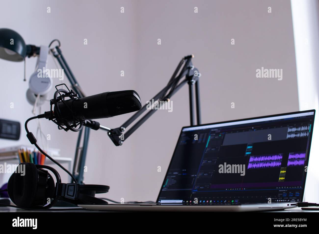 Podcast station with microphone laptop and headphone. Broadcast audio ...