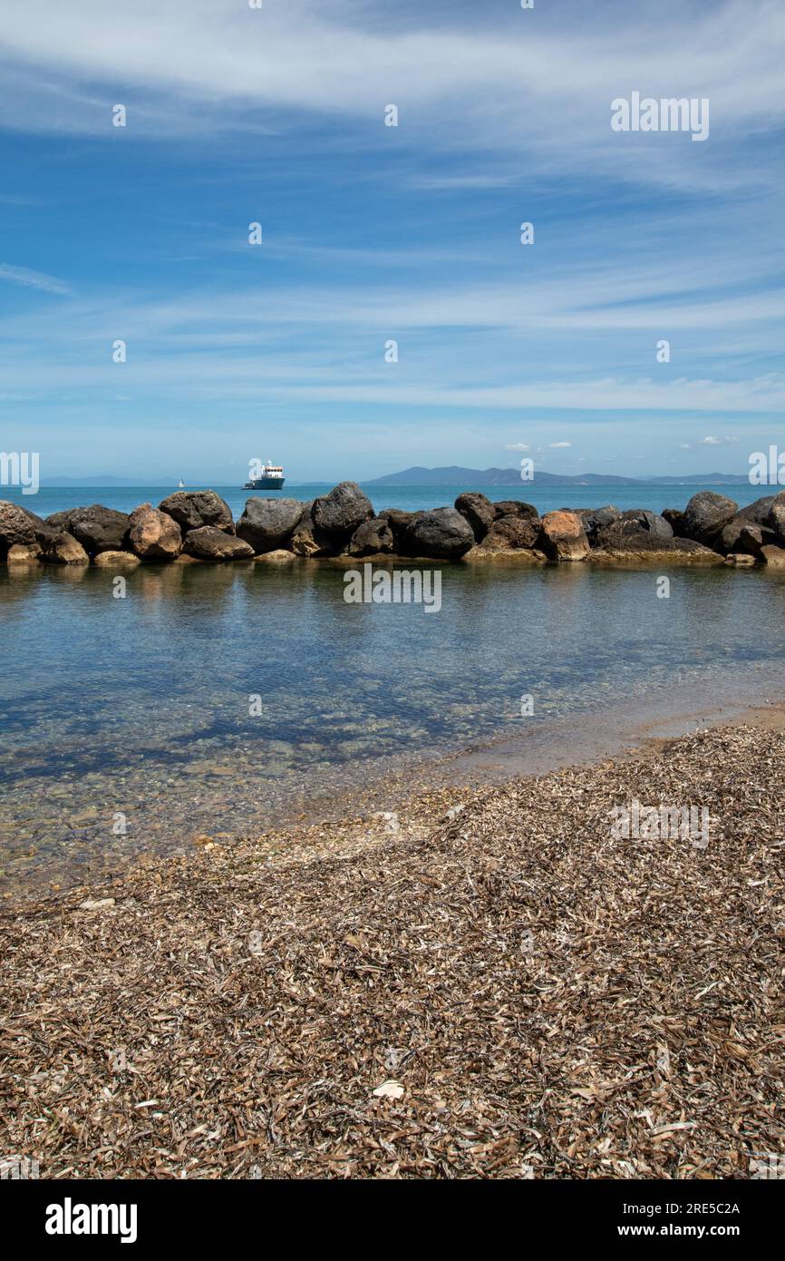 Italian rocky beach with small harbour and big villa. Holiday in Italy ...