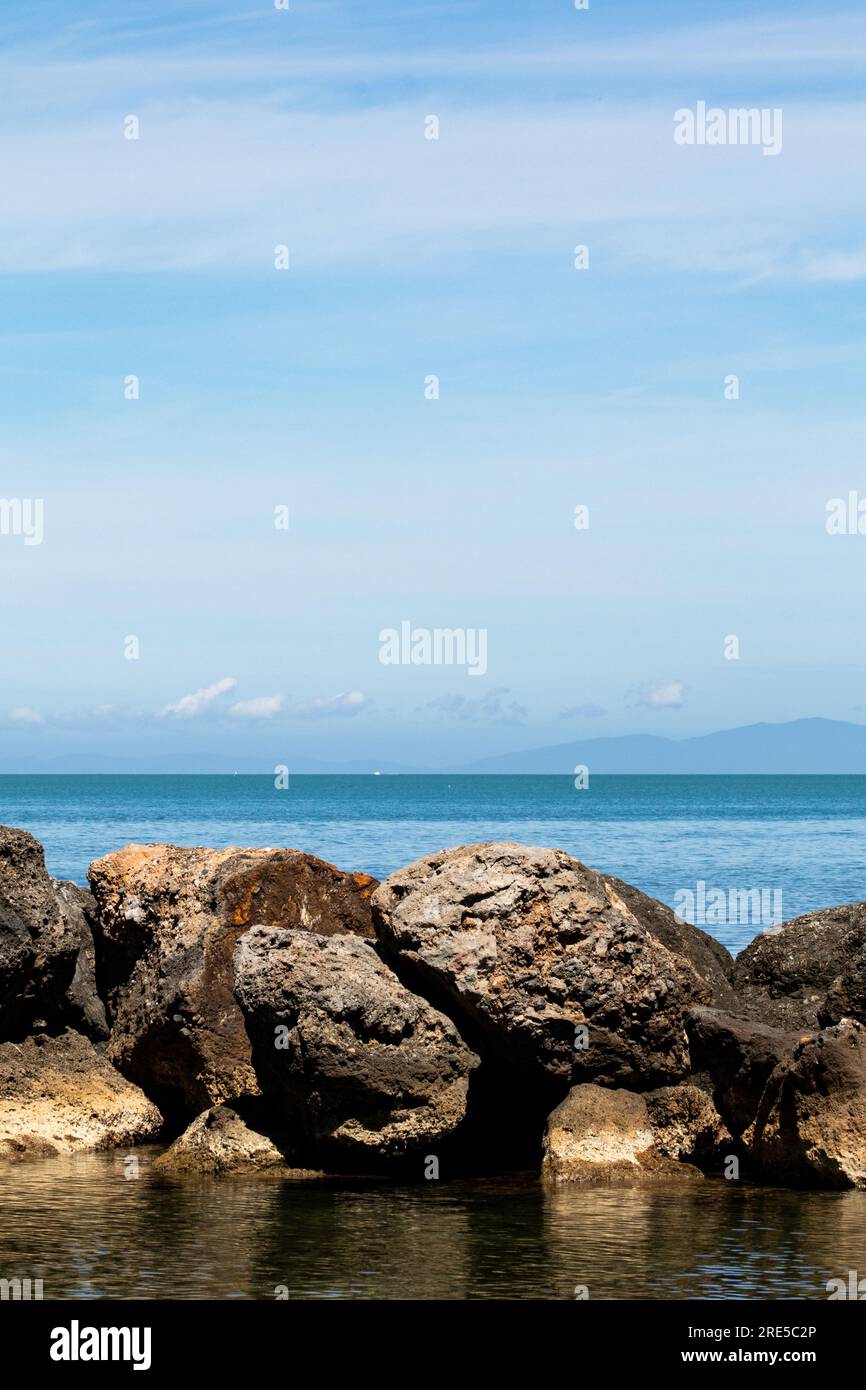 Sea and rock background. Rock and blue sea with clear sky. Seaside ...