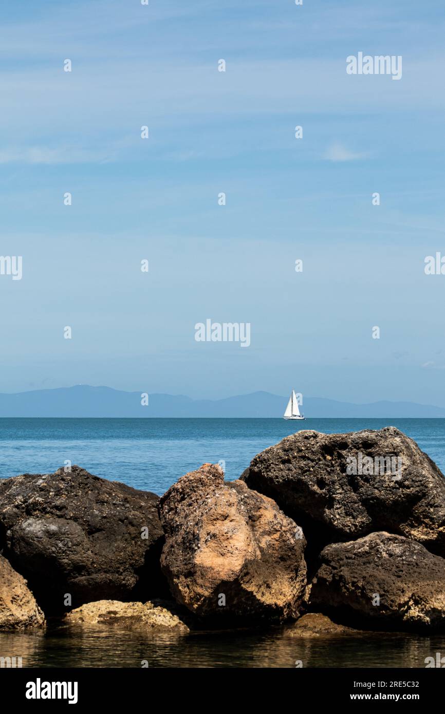 Sea and rock background. Rock and blue sea with clear sky. Seaside ...