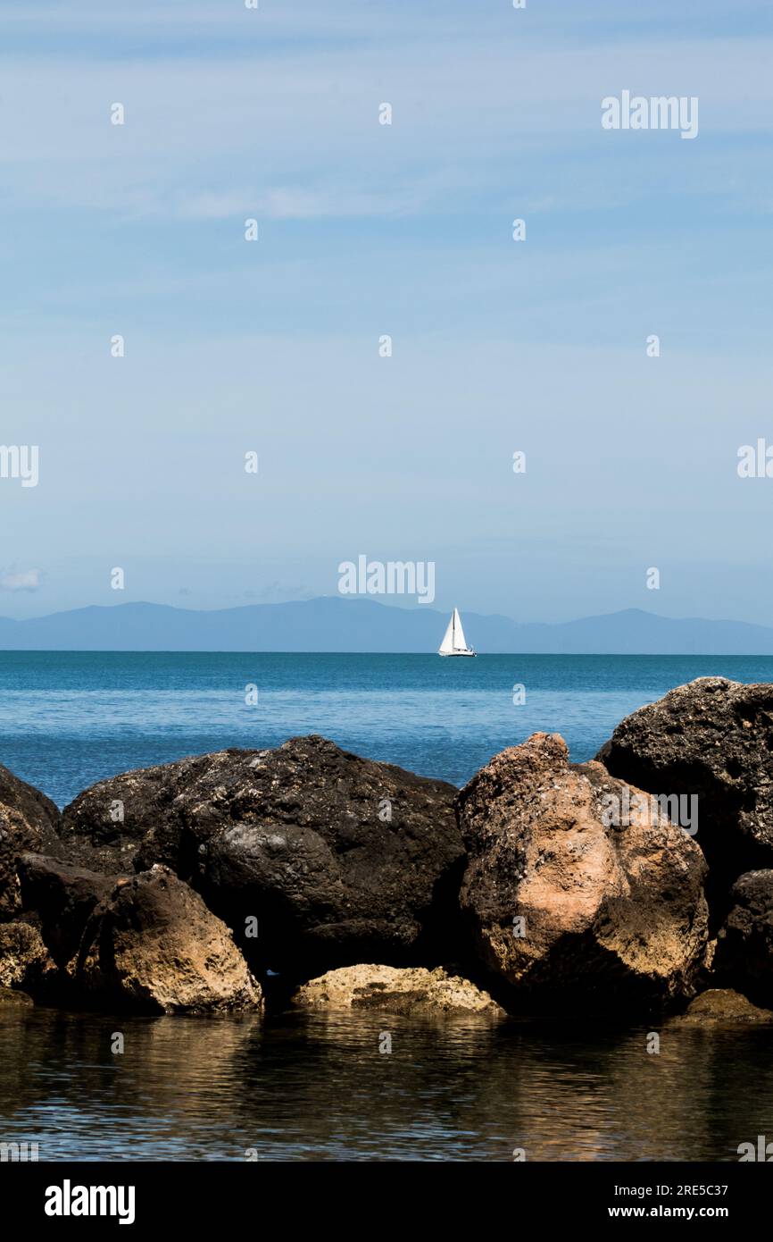 Sea and rock background. Rock and blue sea with clear sky. Seaside ...