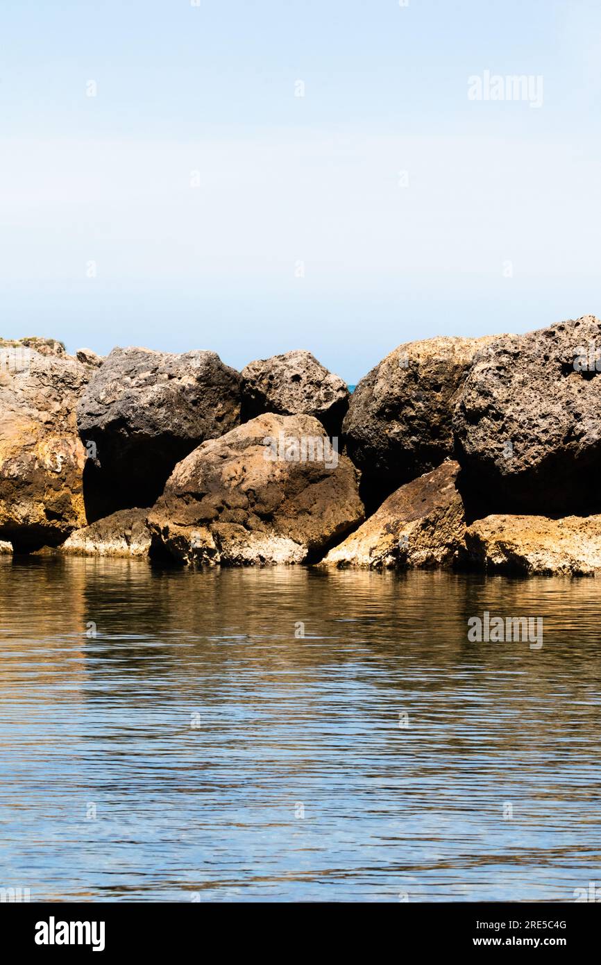 Sea and rock background. Rock and blue sea with clear sky. Seaside ...