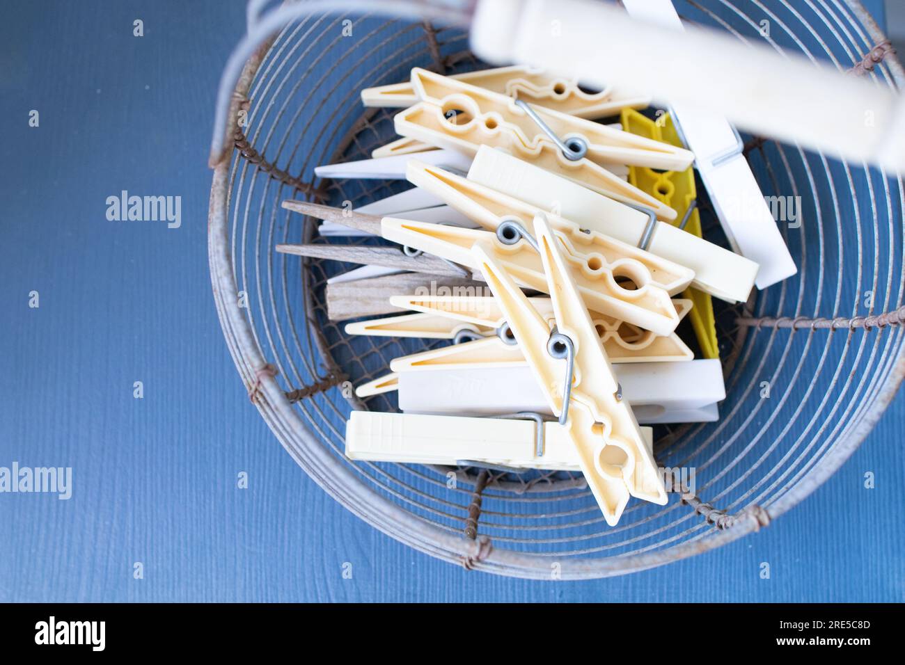 basket of clothes pegs on a blue background. Vintage background Stock ...