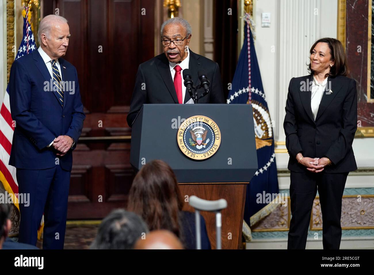 President Joe Biden and Vice President Kamala Harris listen as Rev ...