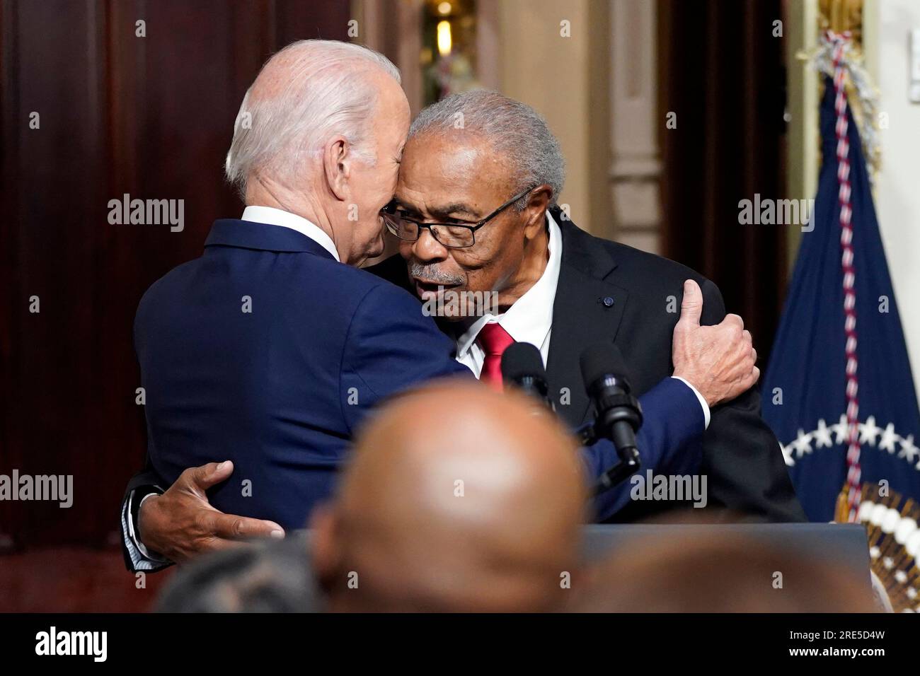 President Joe Biden hugs Rev. Wheeler Parker, Jr., at an event to ...