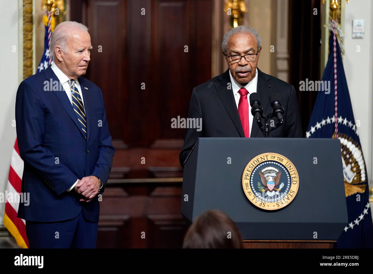 President Joe Biden listens as Rev. Wheeler Parker, Jr., speaks at an ...
