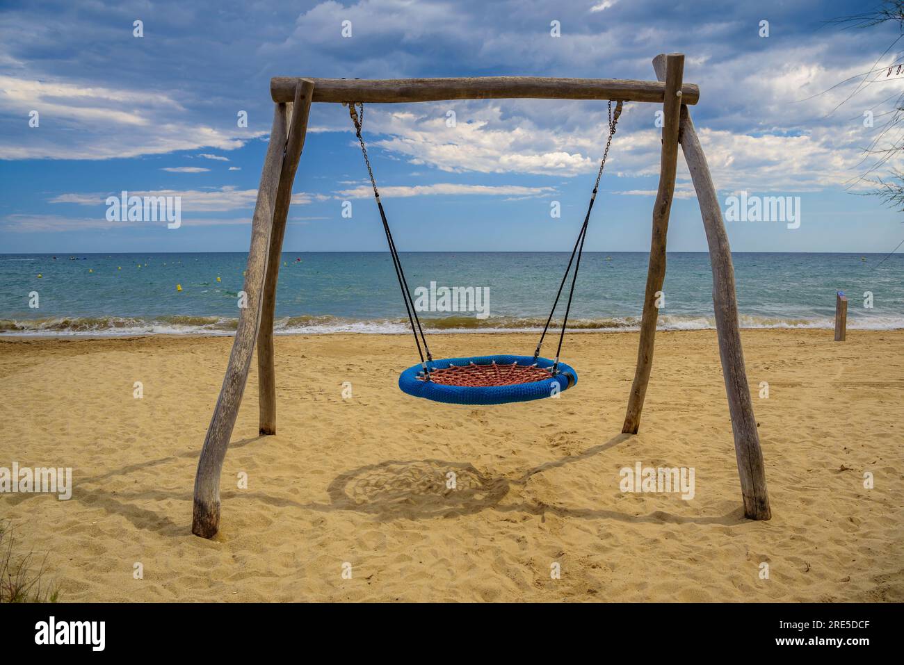 Swing on the Platja de Ponent (west beach) of Salou, on the Costa ...
