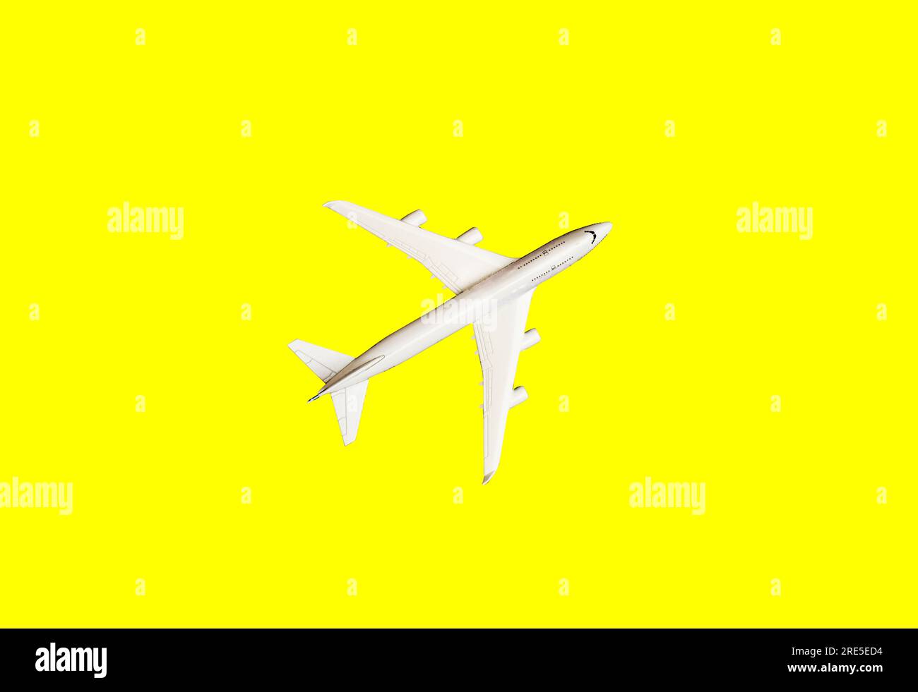 White plane, airplane in yellow color. Rainbow gradient background with ...