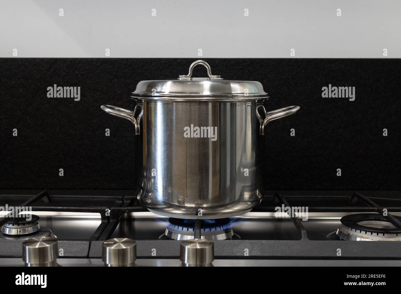 Cover a pot you are cooking with with a lid. Steel pot comes covered ...