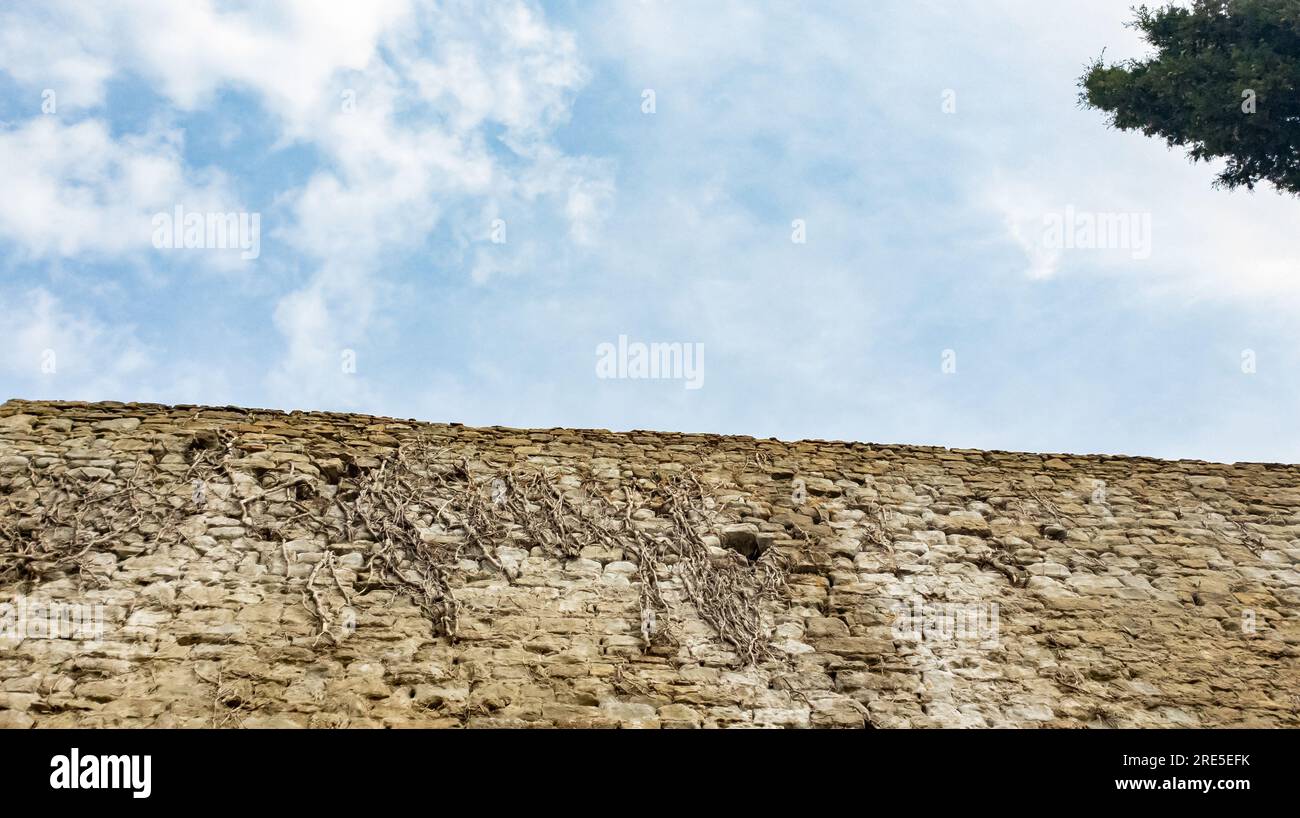 Ancient wall texture background with sky and copyspace for text Stock ...