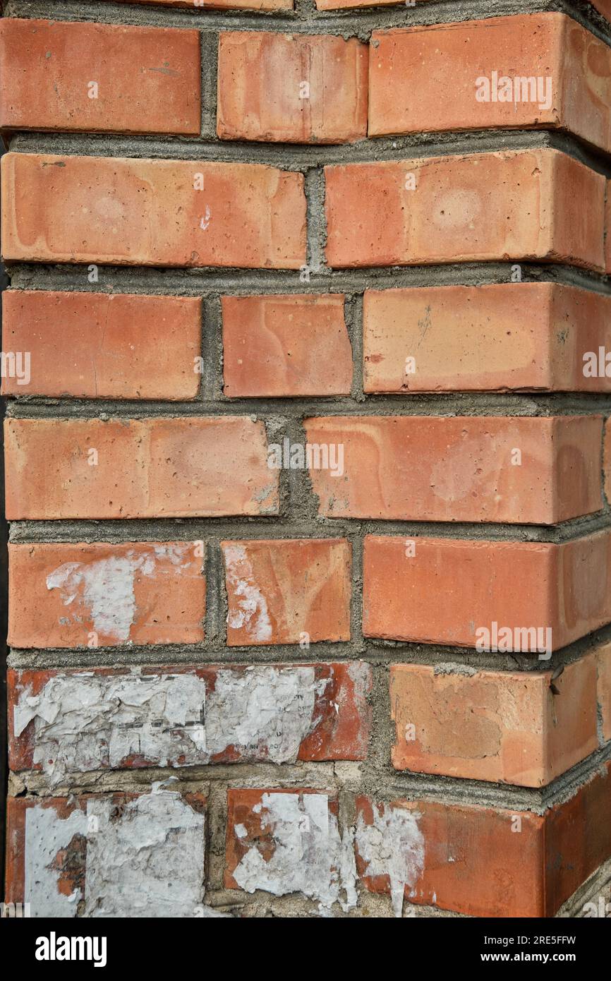 Red brick and brick edge from pillar in front of wall as texture ...