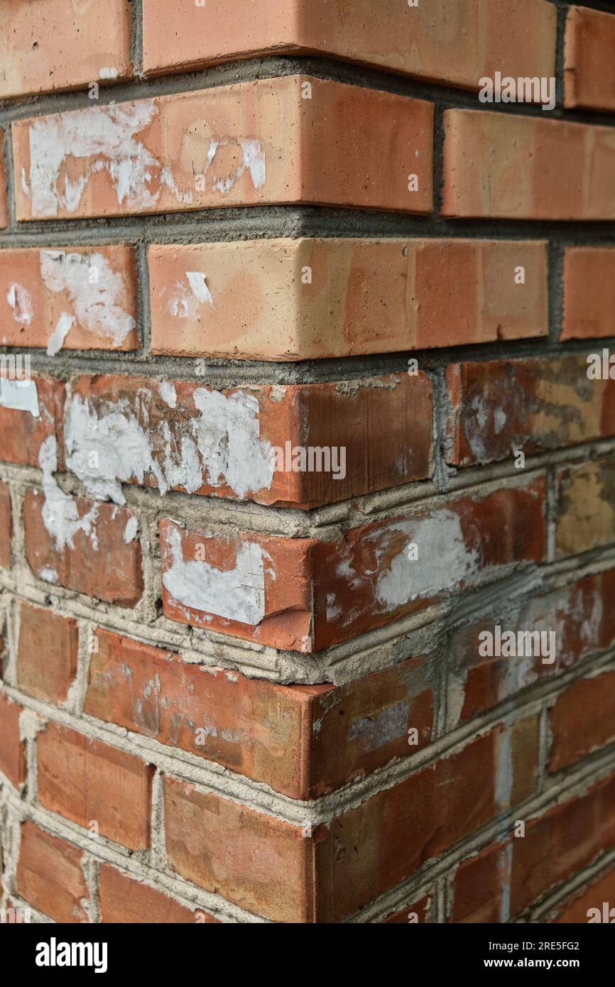 Red brick and brick edge from pillar in front of wall as texture ...