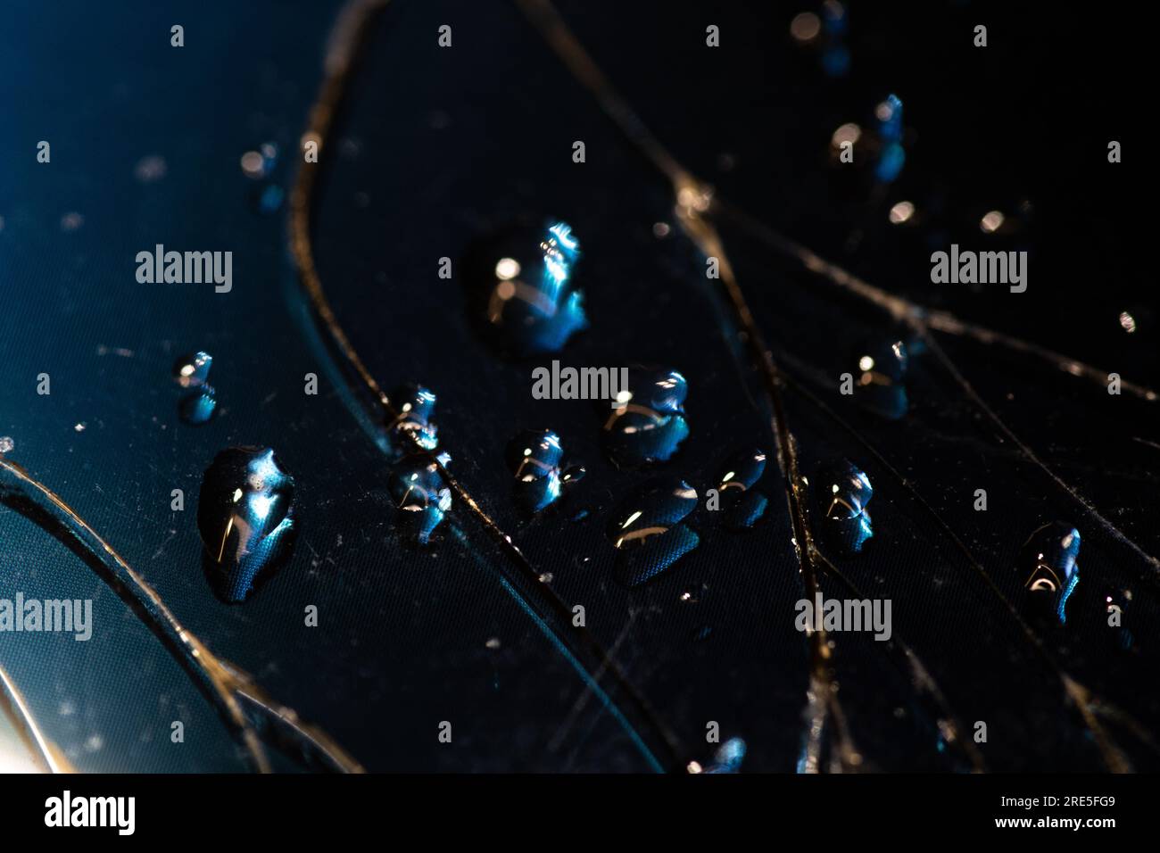 Cracked glass with water drop. Broken glass background with drop of ...