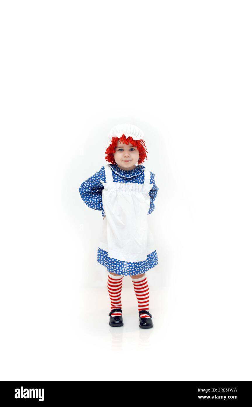 Old fashioned Raggedy Ann style costume is worn by a cute little girl ...