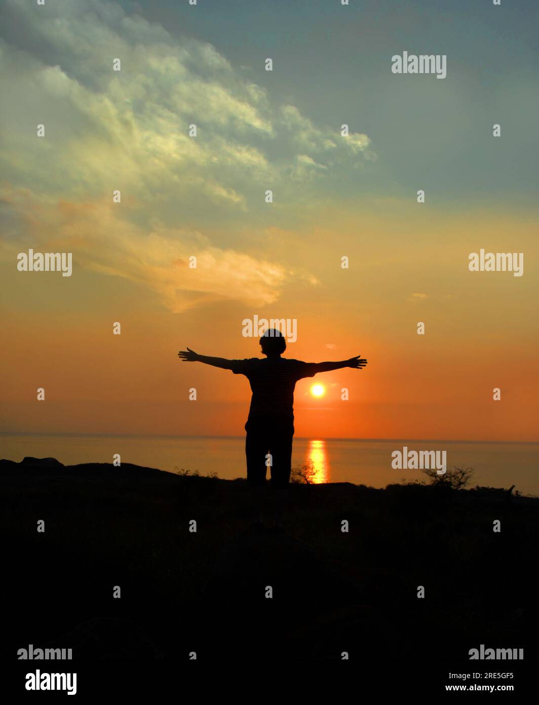 Visitor stands with arms wide saying goodbye to the Big Island of ...