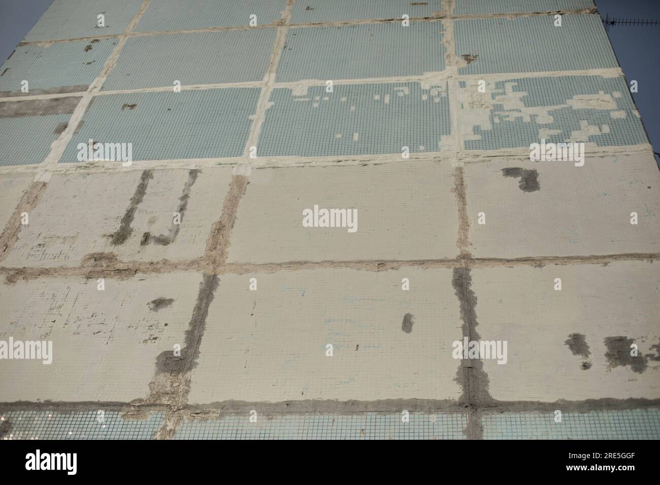 Wall of building without windows. Tiles on building. Architectural ...