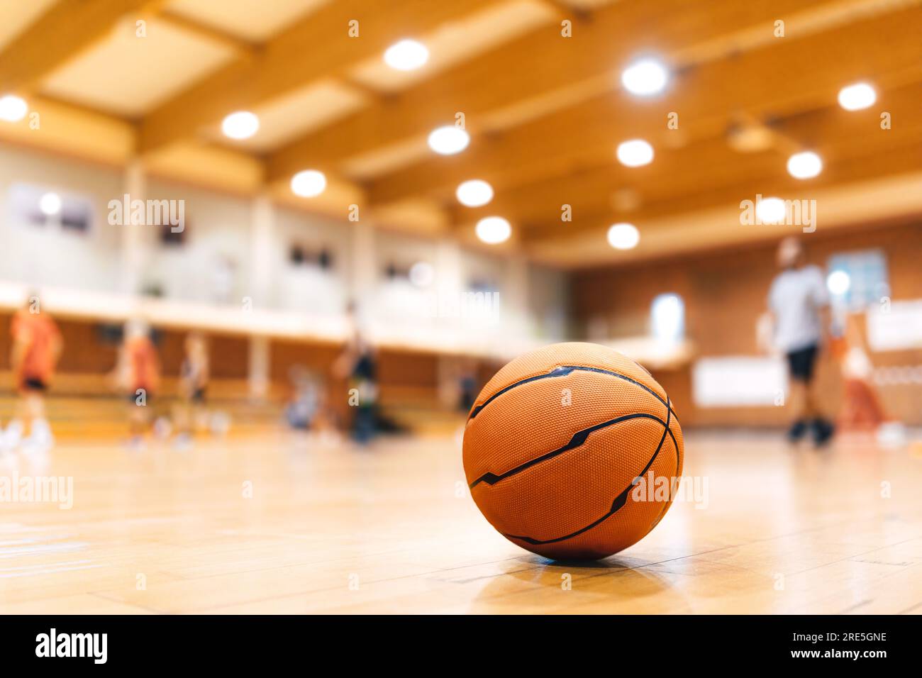 Basketball Ball on Wooden Court. Basketball Game in the Blurred ...