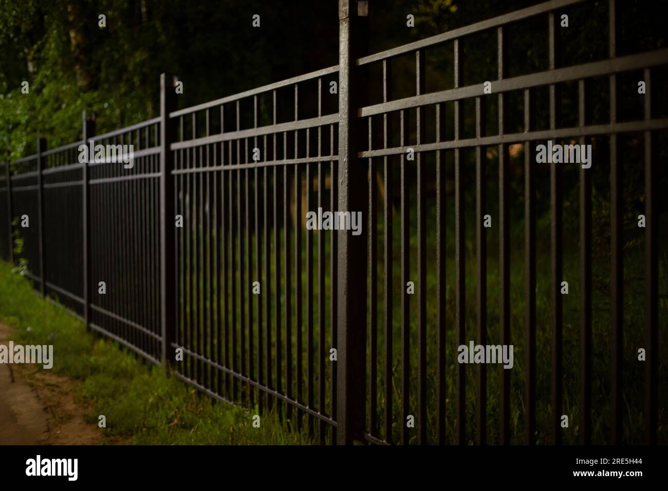 Black Fence at Night. Fence in dark. Steel profile. Private area in ...