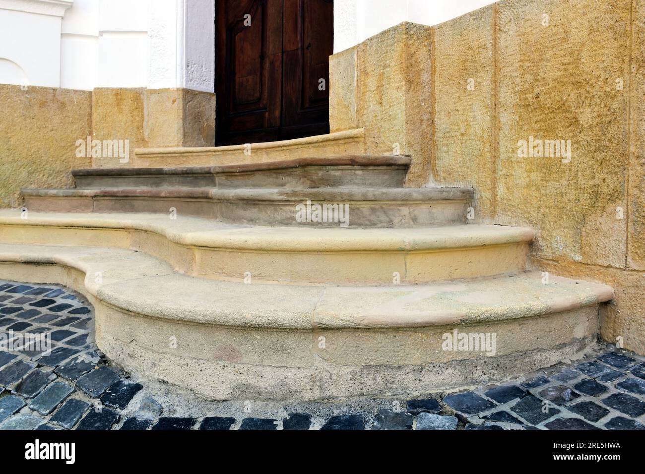 curved old stone stairs in closeup view. bright lights and shadows ...