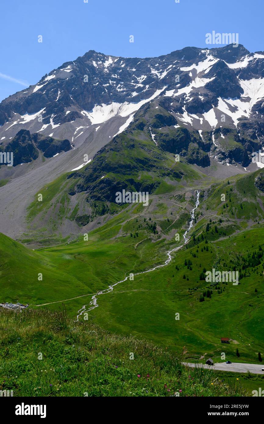 Mountains and green alpine meadows views near Col du Lautaret, Massif ...