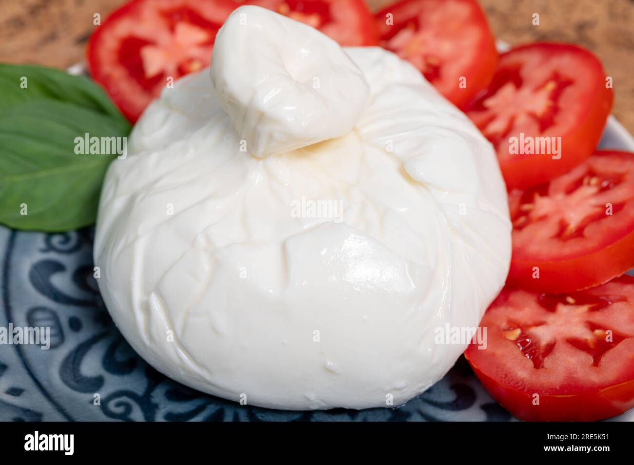 Fresh handmade soft Italian cheese from Puglia, white ball of burrata ...