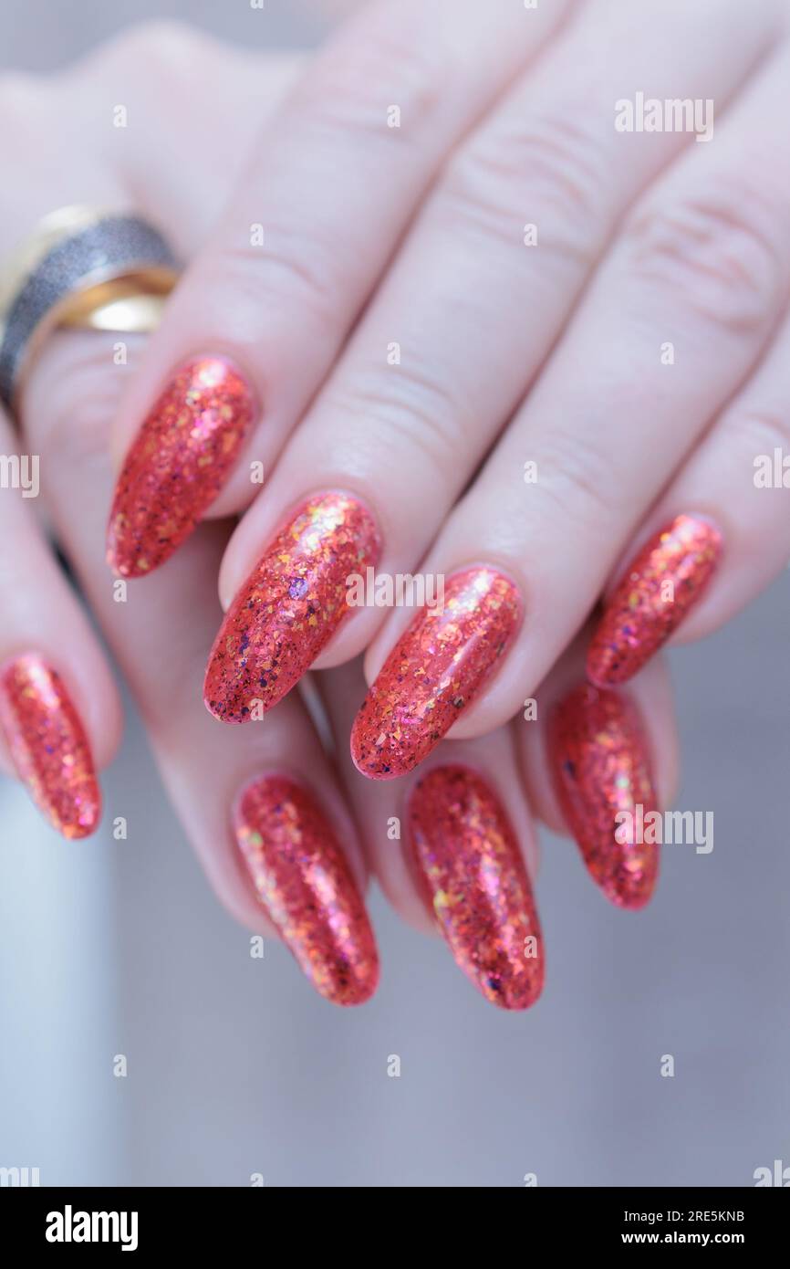Female hand with long nails and a bright red manicure Stock Photo - Alamy