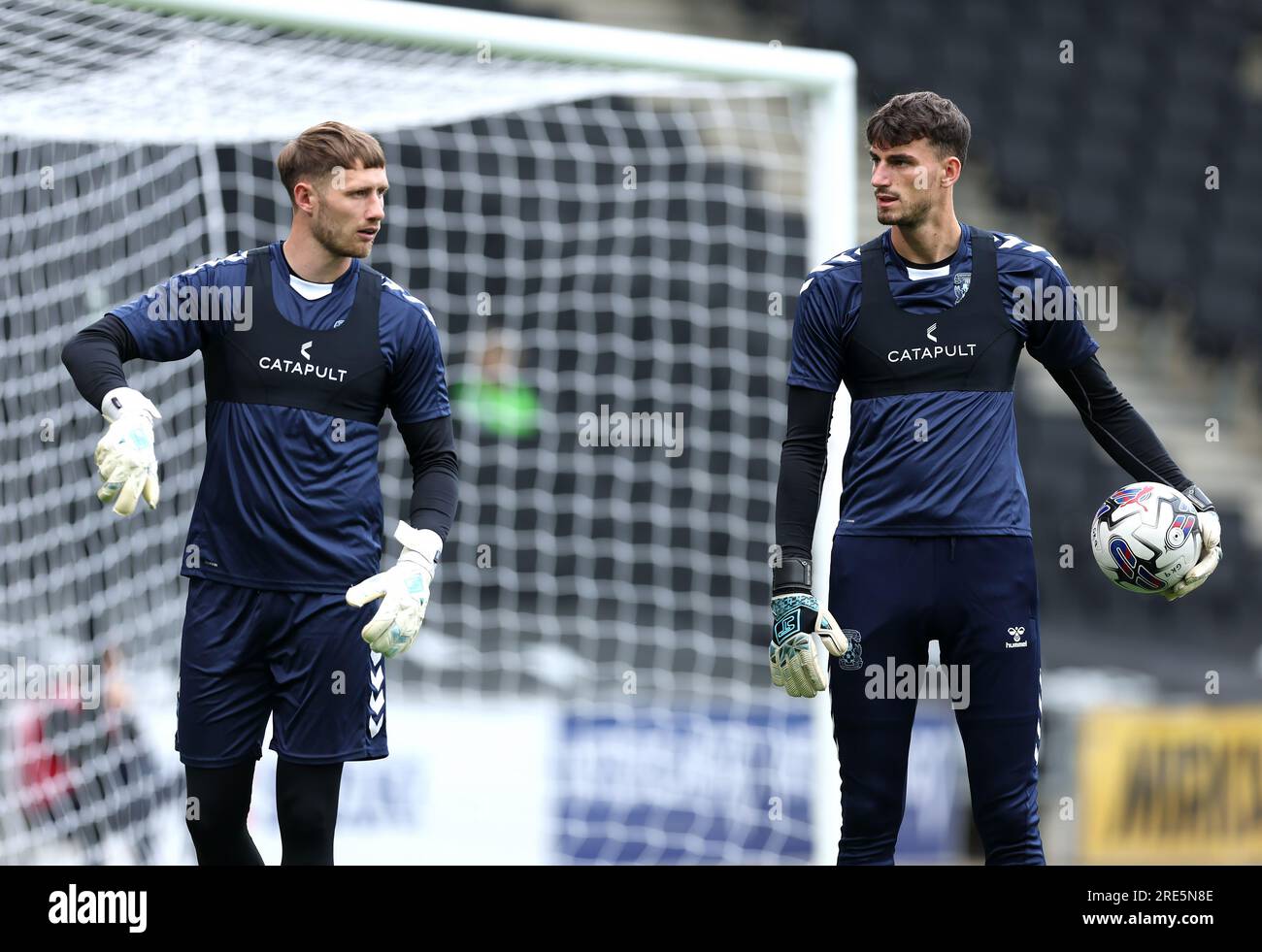 Coventry City goalkeepers Bradley Collins (left) and Cian Tyler warming ...