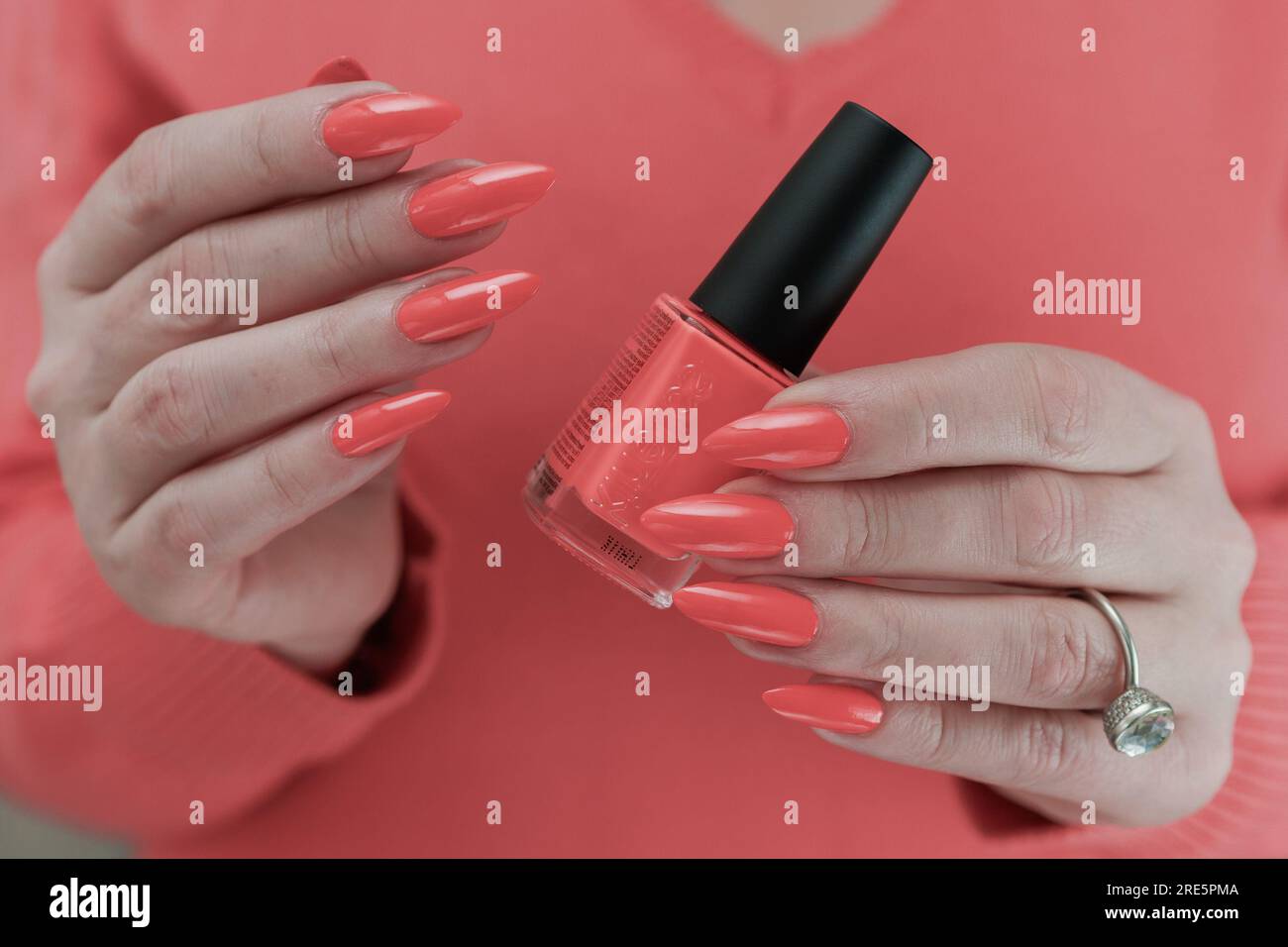 Hands of woman with long fingernails hi-res stock photography and ...