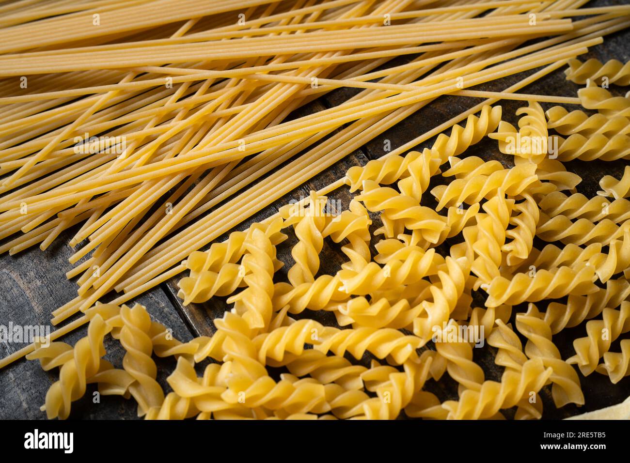 Pasta shapes, raw spaghetti and fusilli, Italian cuisine ingredients on ...