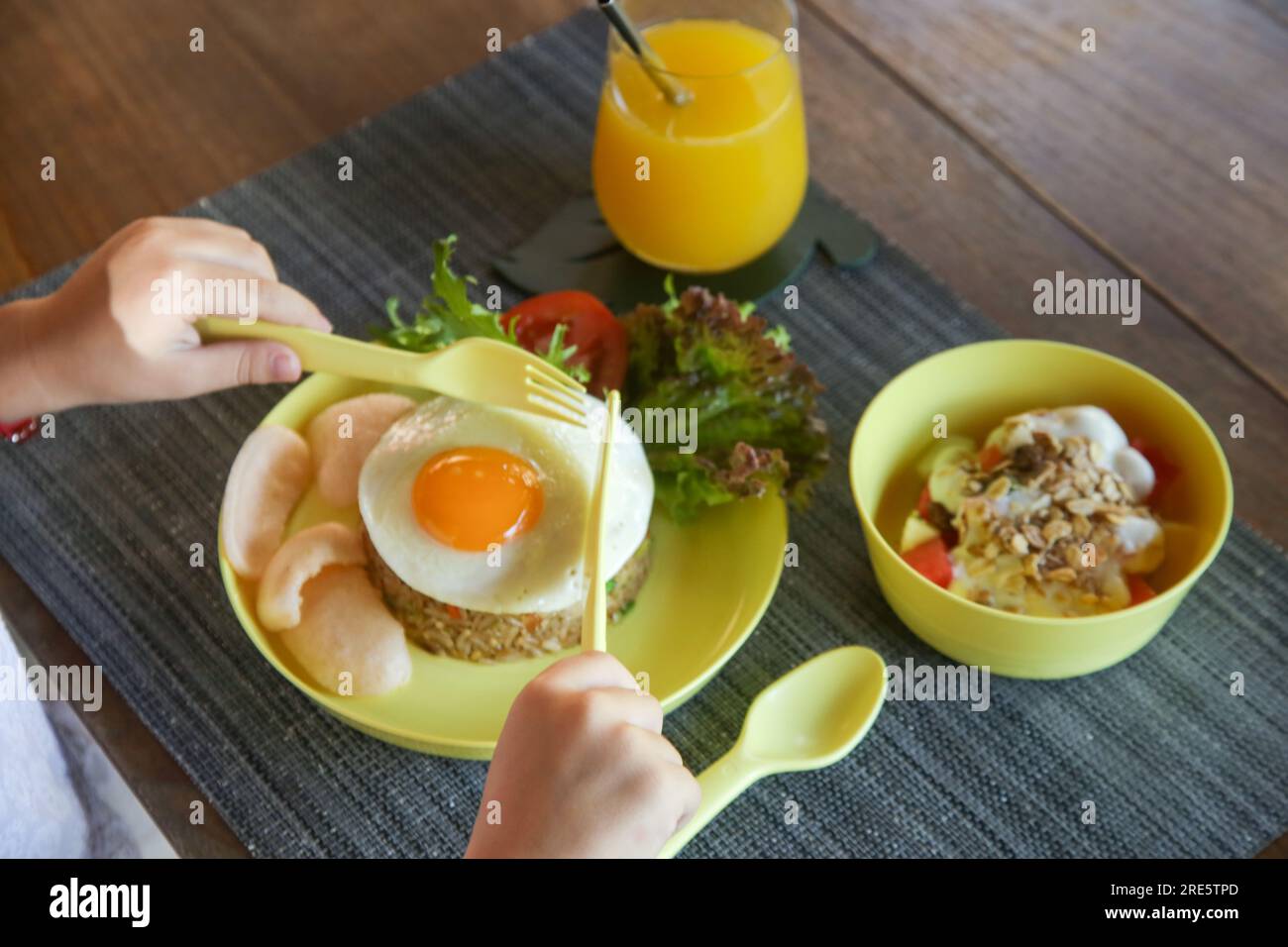 Kids menu - sunny side up, rice, green salad and muesli with yoghurt ...