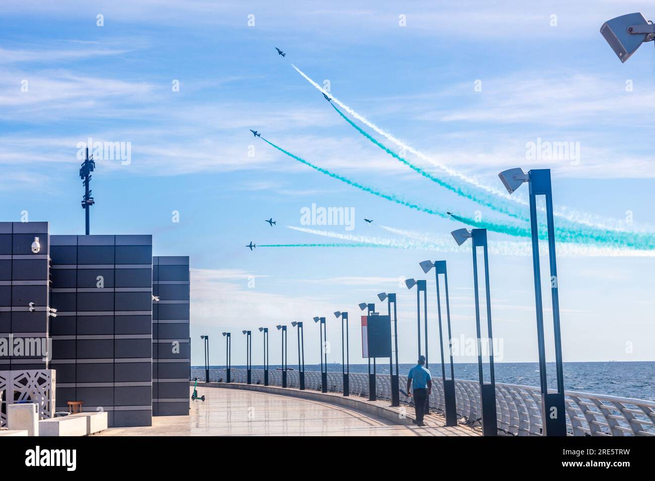 Fighter jets squadron with traces in Saudi Arabian national flag colors ...