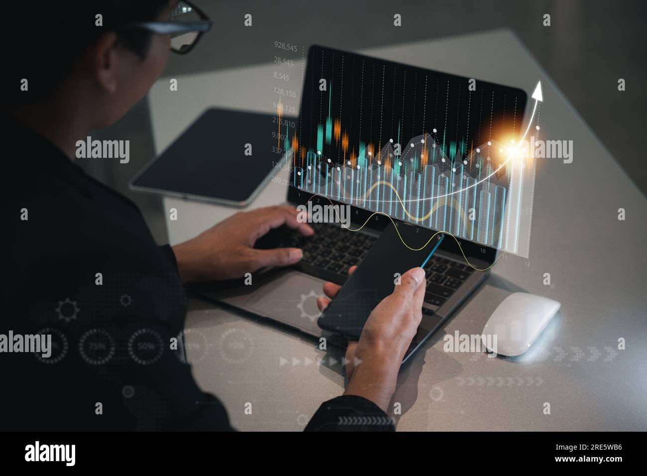Man monitoring stock market trends and trading activities Stock Photo ...