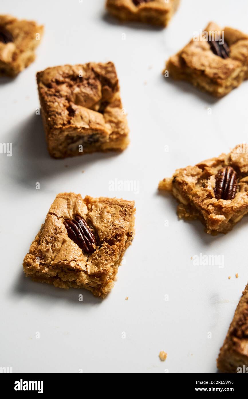 blondie cookies squares on white marble countertop background. White ...