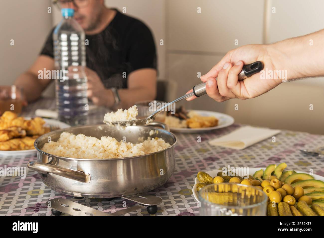 Man with serving homemade food Stock Photo - Alamy