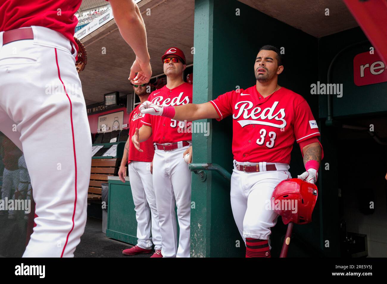 Cincinnati Reds' Christian Encarnacion-Strand (33) stands in the dugout ...