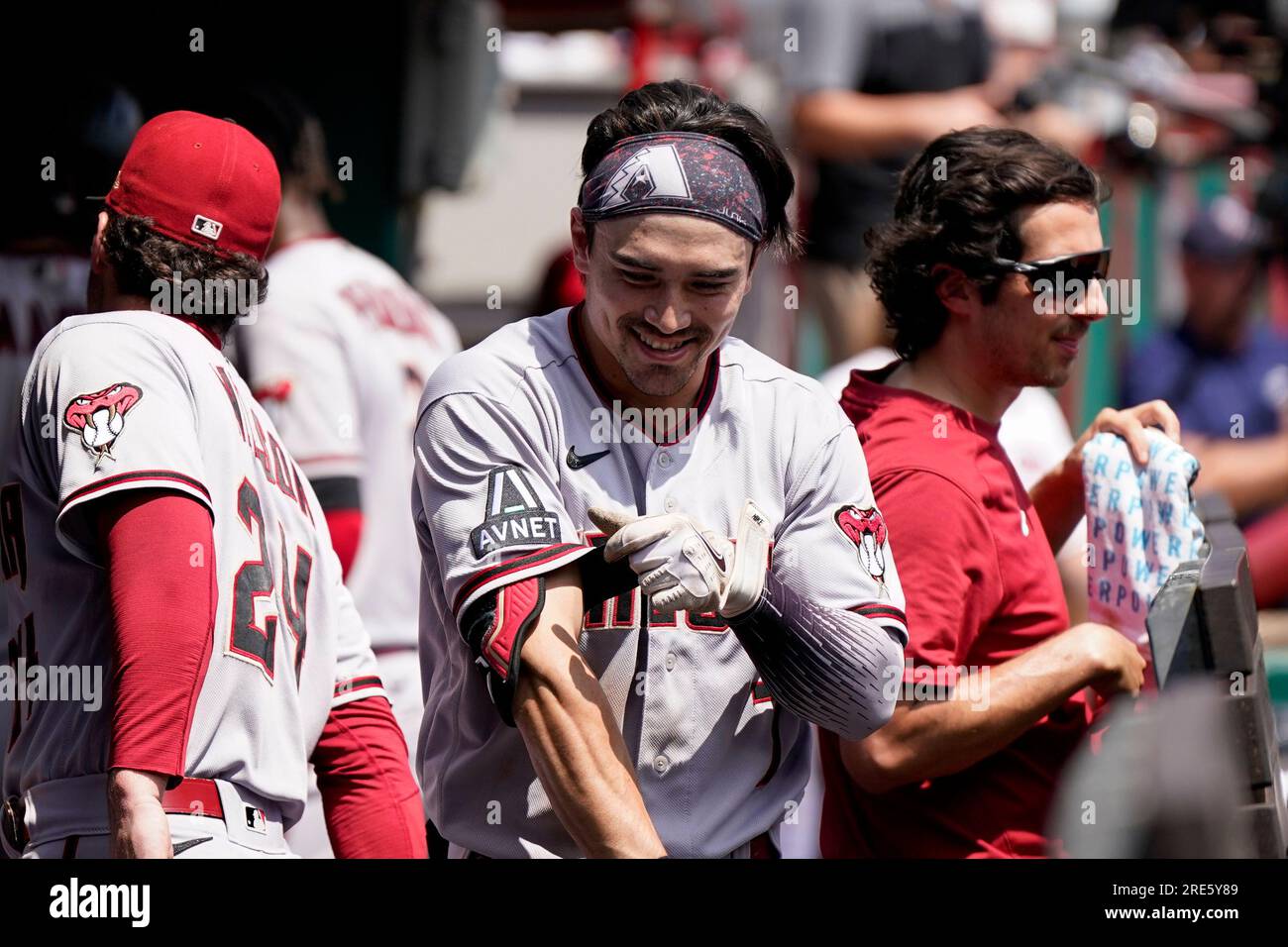 Arizona Diamondbacks' Corbin Carroll, center, walks through the dugout ...